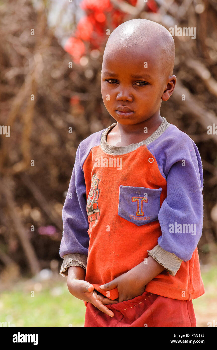 AMBOSELI, KENYA - OCTOBER 10, 2009: Unidentified Massai little sad boy ...