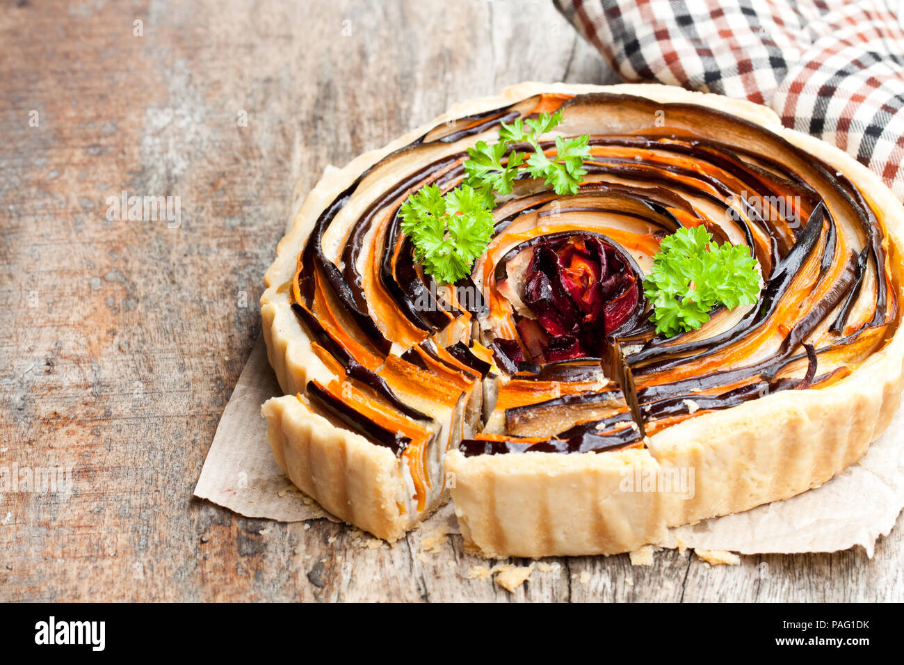 Homemade vegetarian pie with colored vegetables on wooden table Stock ...
