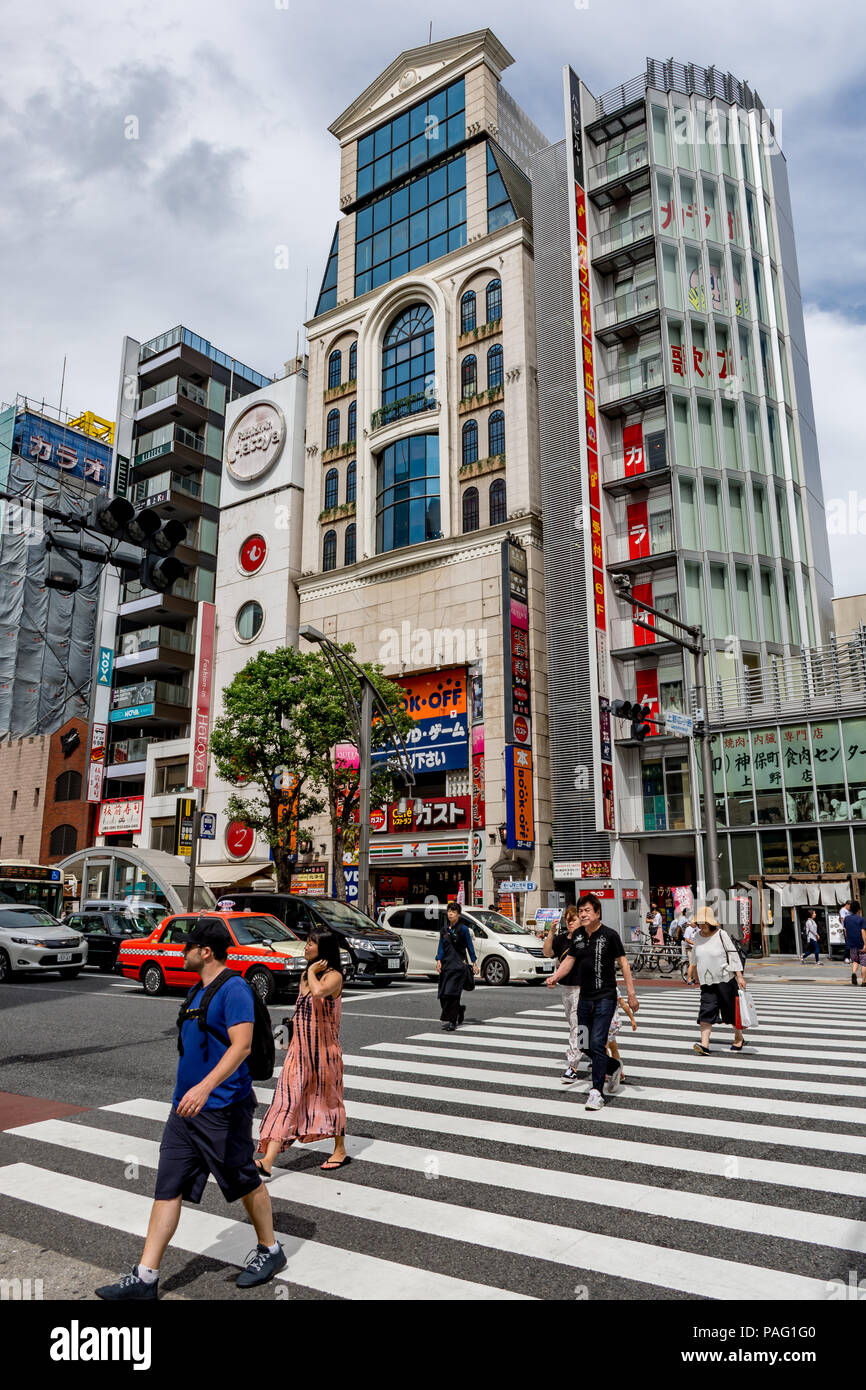 People walking across zebra crossing in Tokyo, Japan with diverse ...