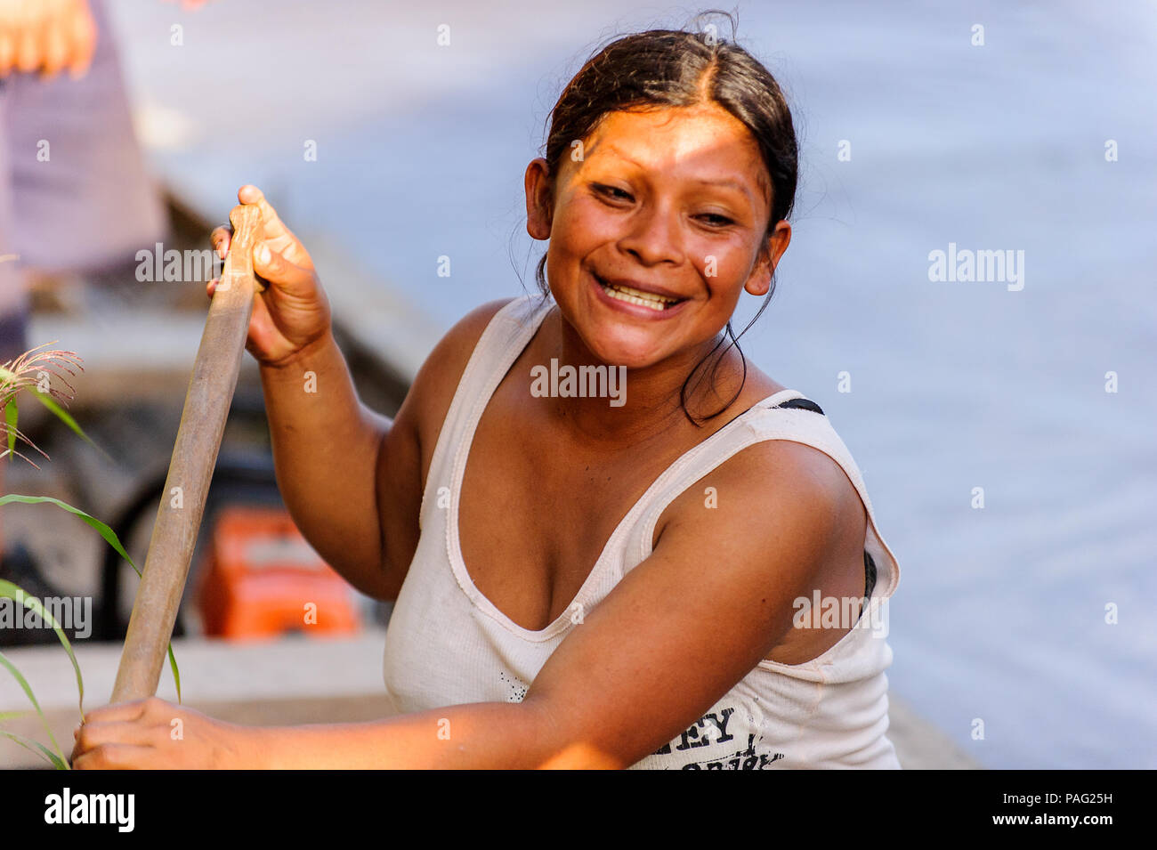 AMAZONIA, PERU - NOV 10, 2010: Unidentified Amazonian woman raws a ...