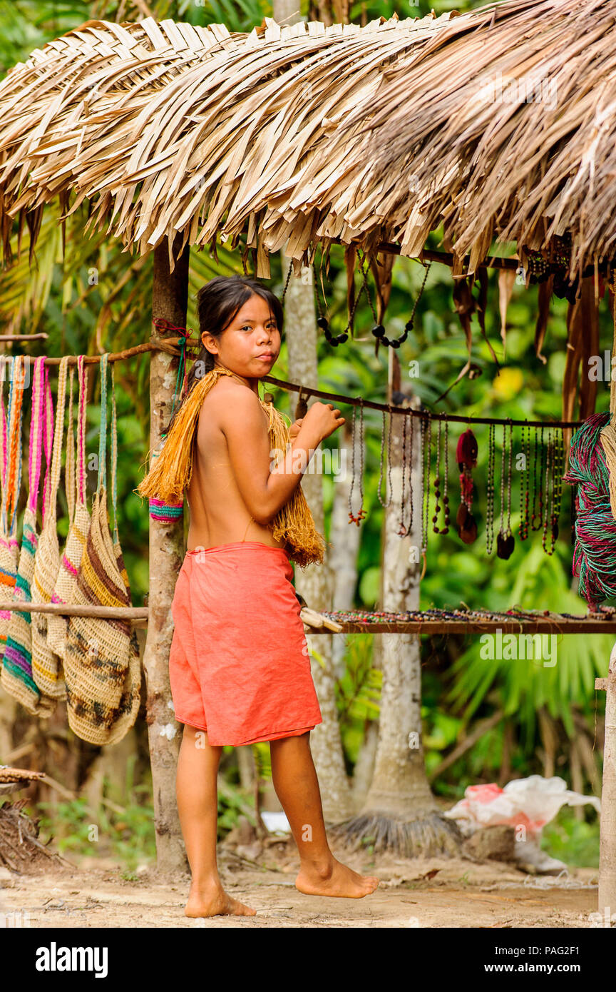 AMAZONIA, PERU - NOV 10, 2010: Unidentified Amazonian girl sells beads ...