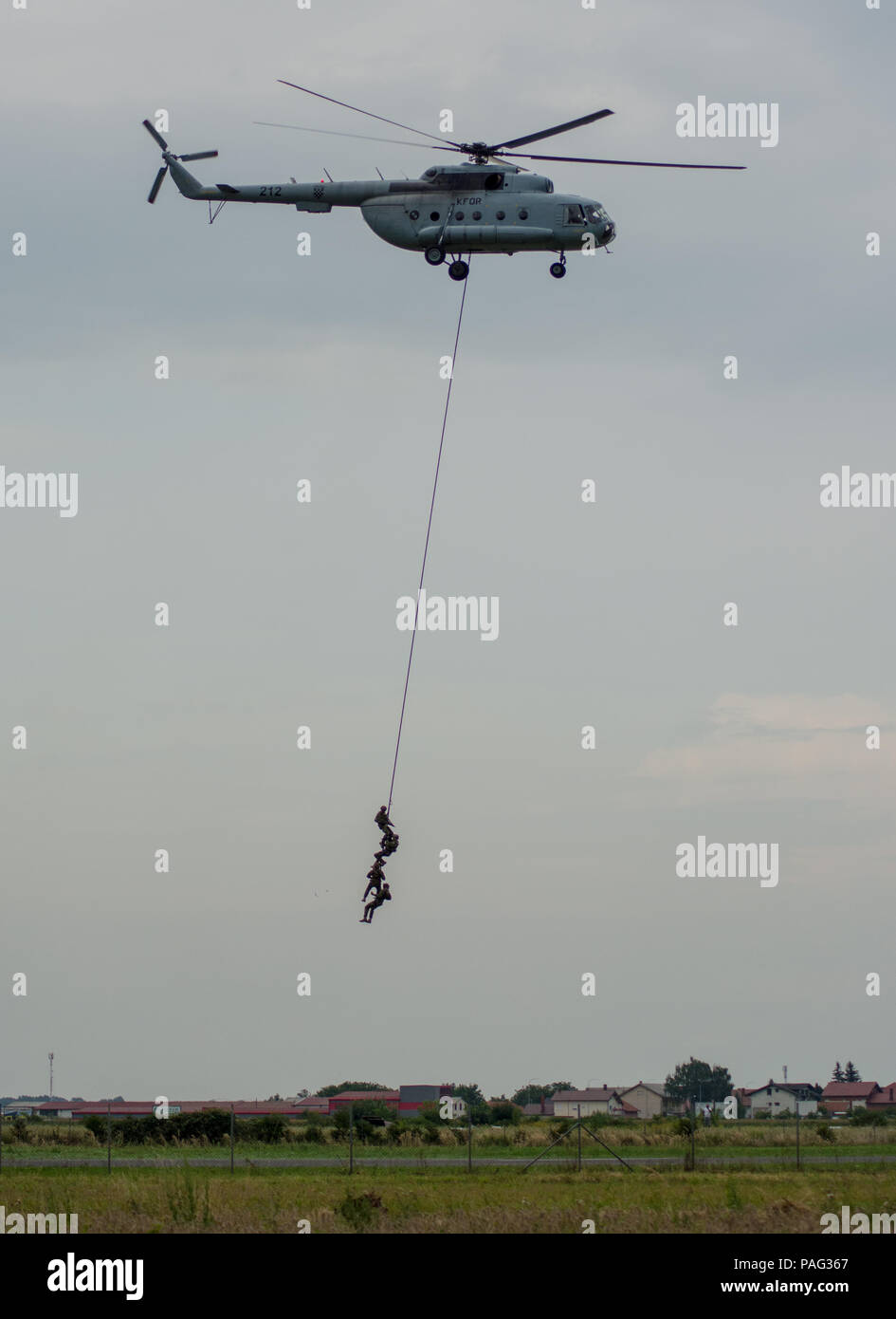 Hanging from helicopter hi-res stock photography and images - Alamy