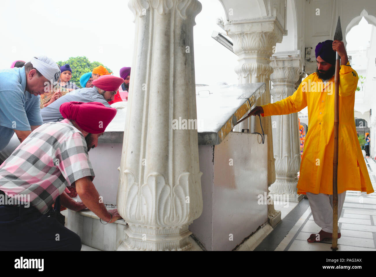 Guard men at the Golden Temple, monitoring visitors and ensuring sacred ...