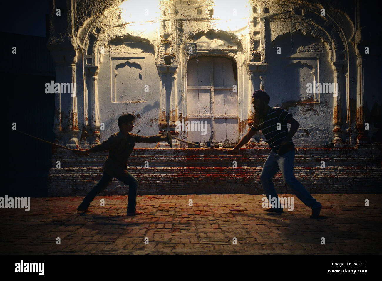 Sikh young men practicing Gutka, the sikh martial art Stock Photo - Alamy
