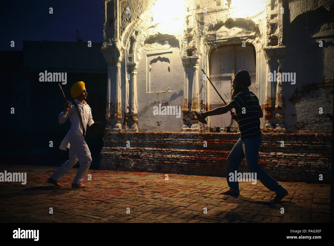 Sikh young men practicing Gutka, the sikh martial art Stock Photo - Alamy