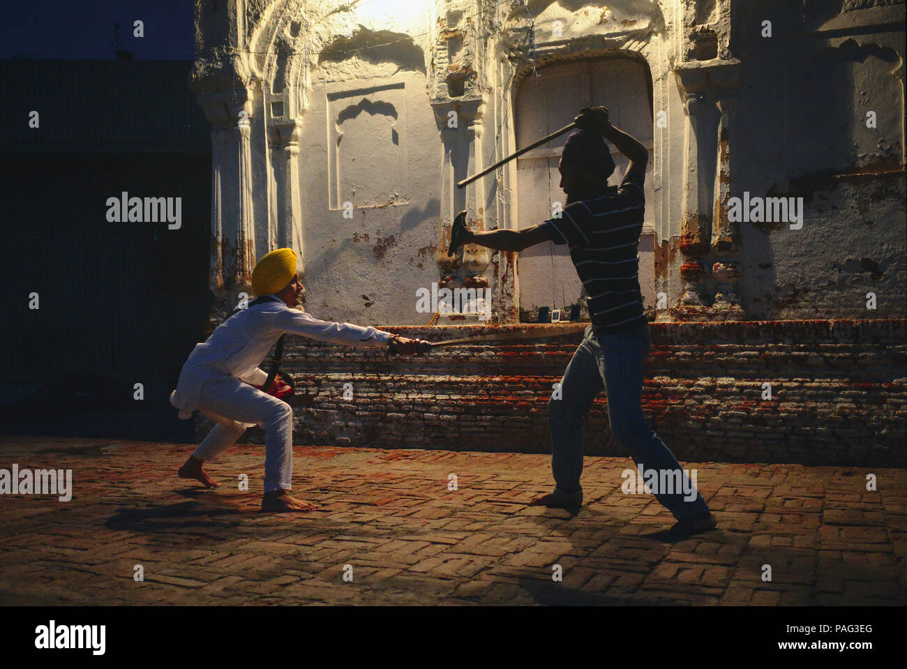 Sikh young men practicing Gutka, the sikh martial art Stock Photo - Alamy