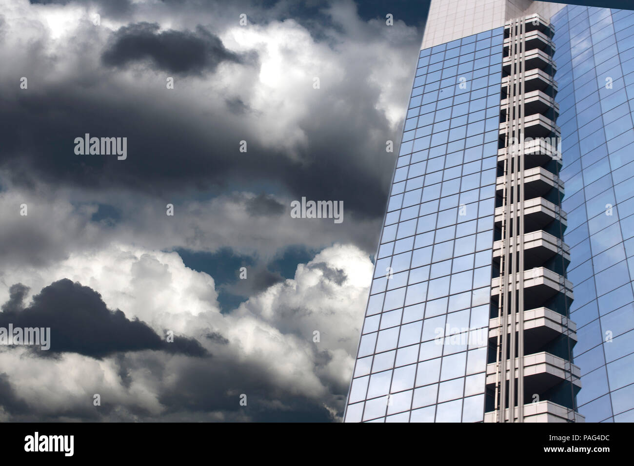 Modern office building on a dramatic sky background Stock Photo - Alamy