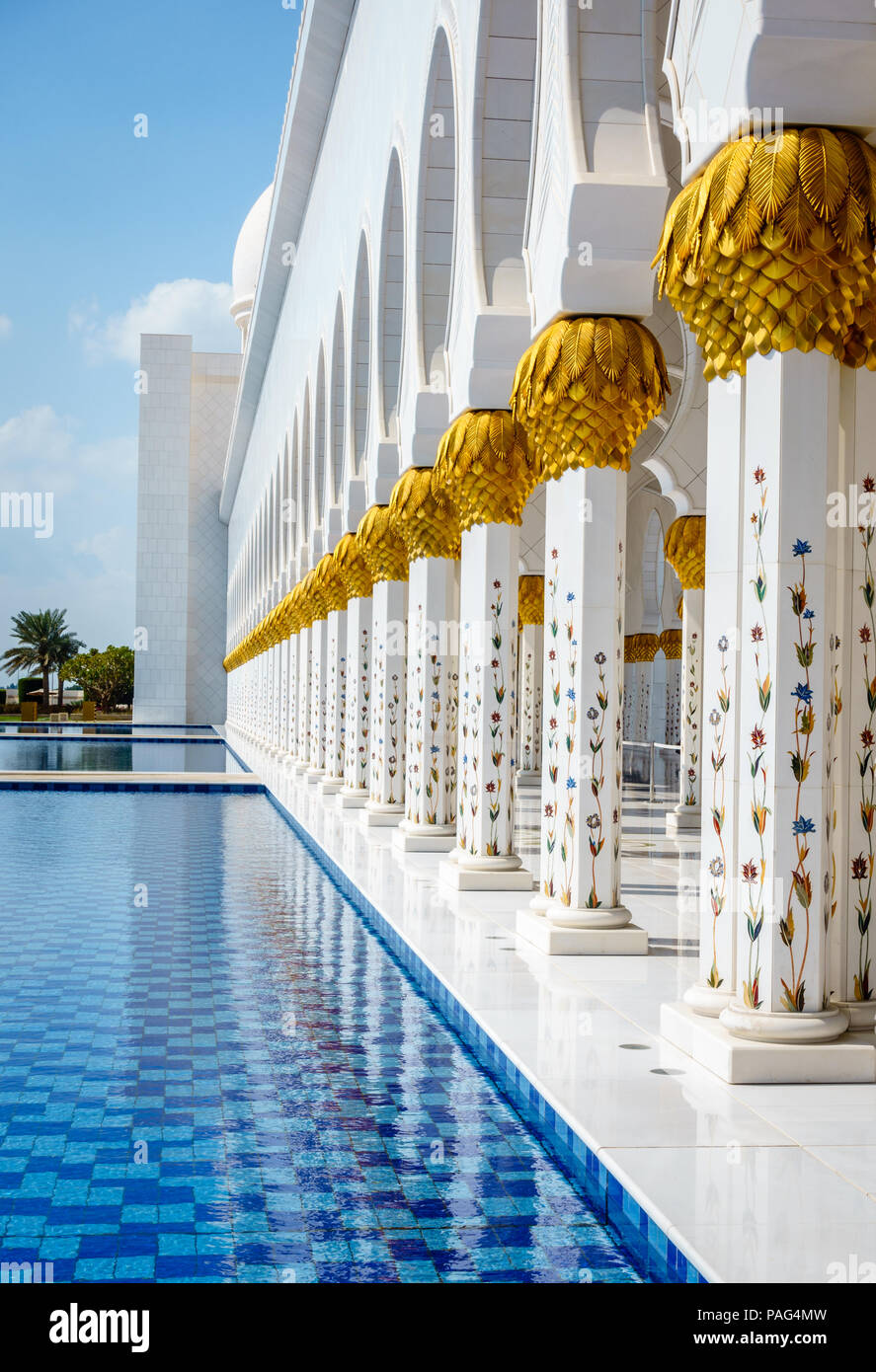 A colonnade and reflection pools in Sheikh Zayed Grand Mosque in Abu ...