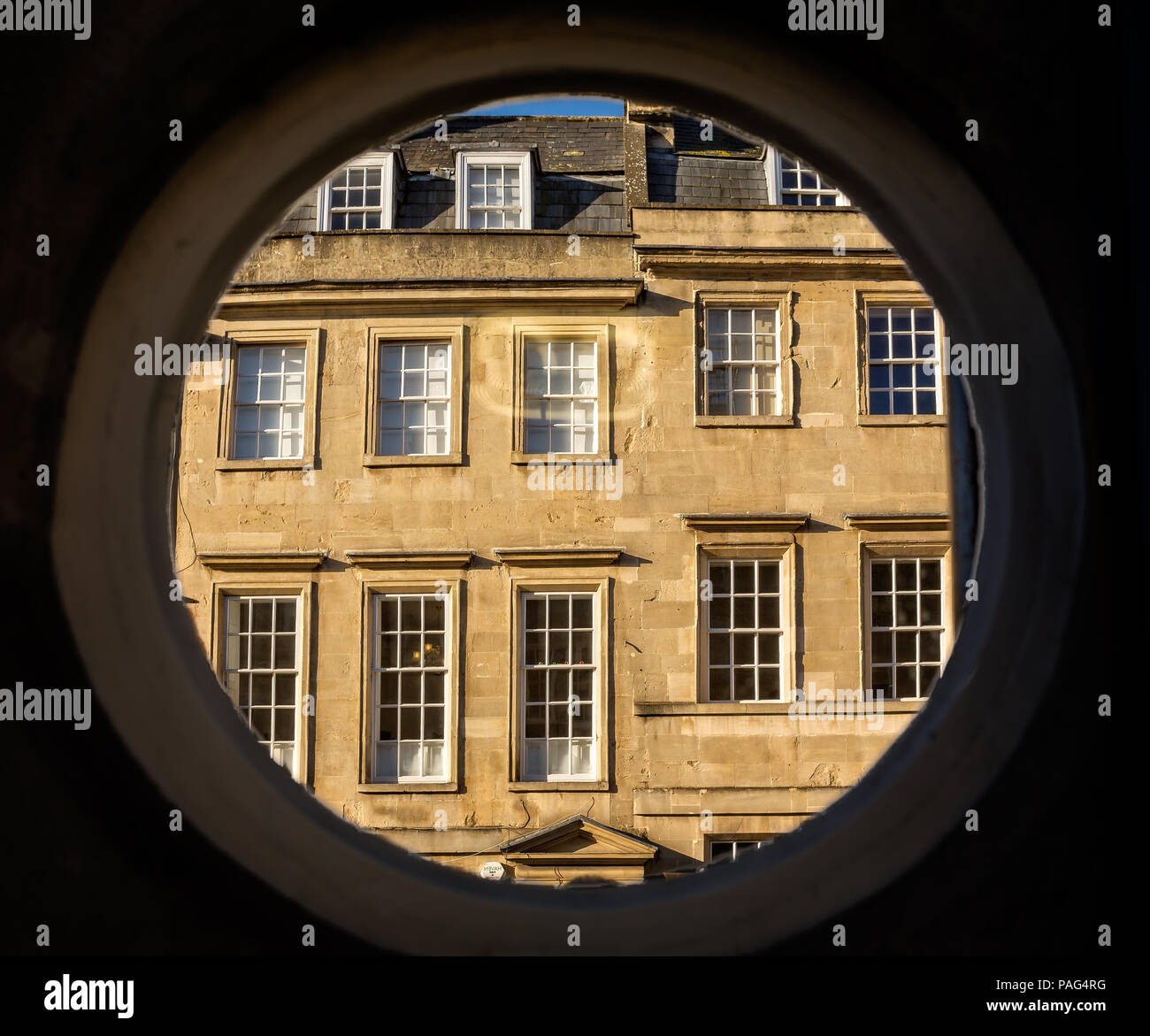 View of Georgian sash windows through circular frame Stock Photo - Alamy