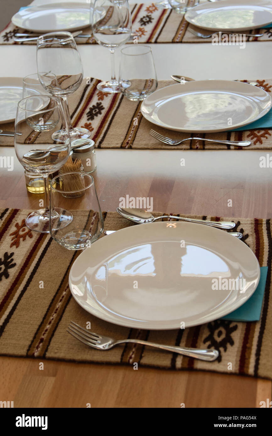 Elegant table set in traditional restaurant, mix between rustic and ...