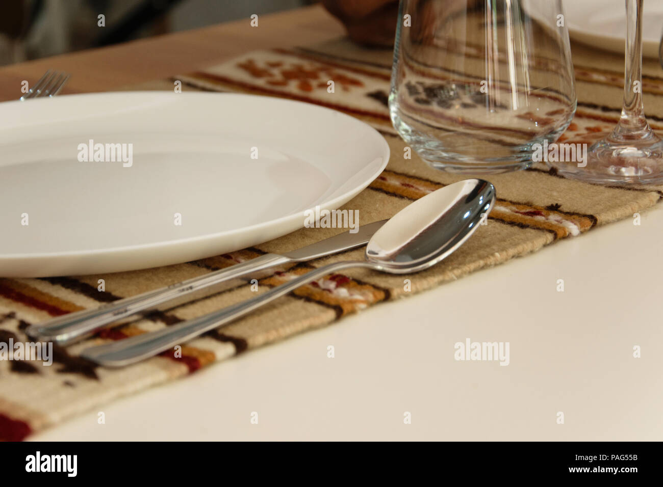 Elegant table set in traditional restaurant, mix between rustic and ...