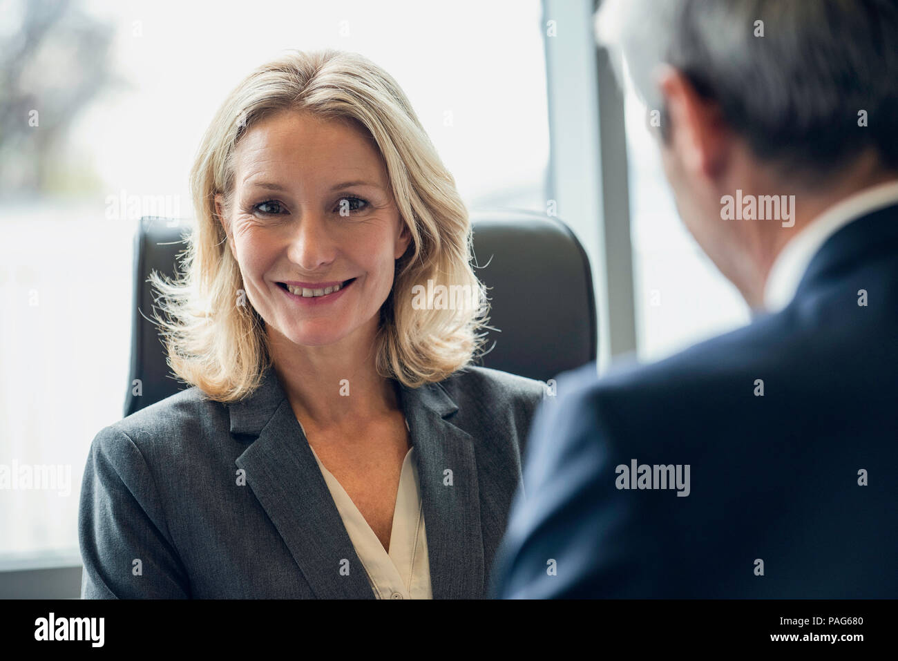 Happy businesswoman colleagues sitting hi-res stock photography and ...