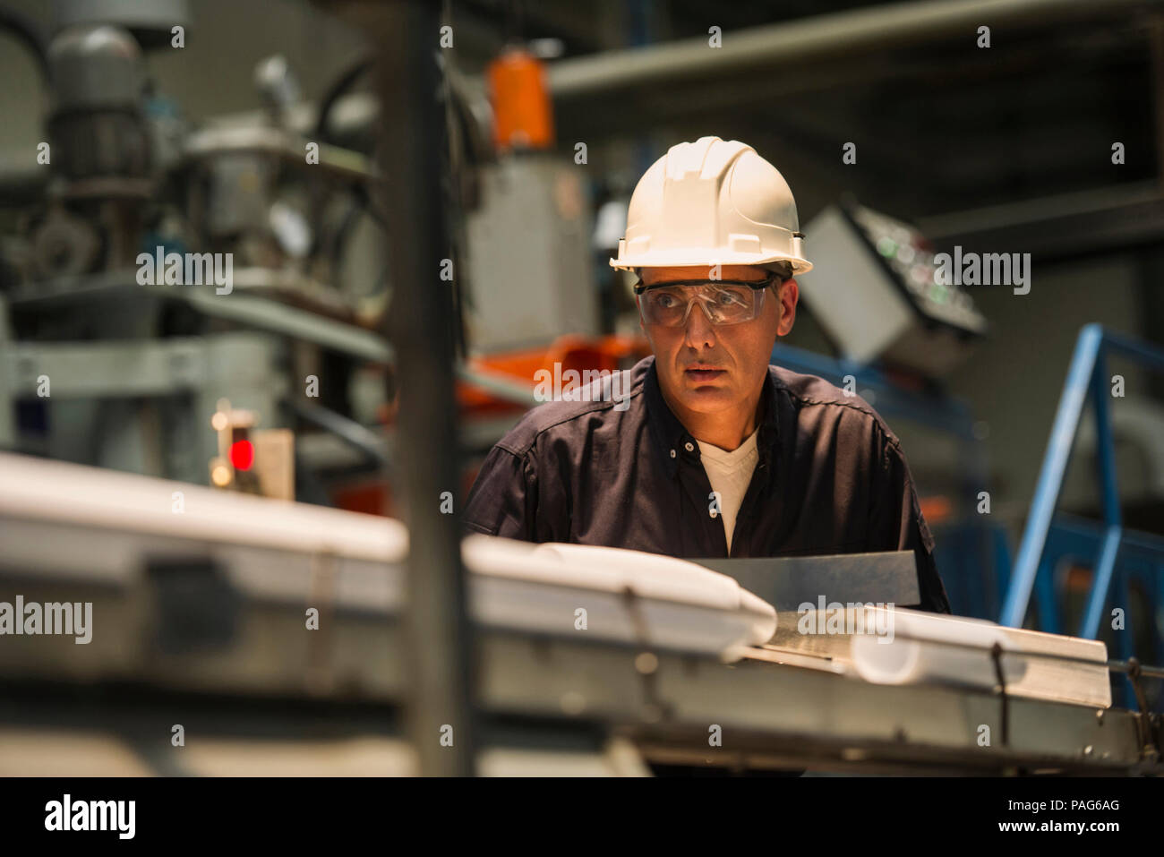 Factory worker working in factory Stock Photo - Alamy