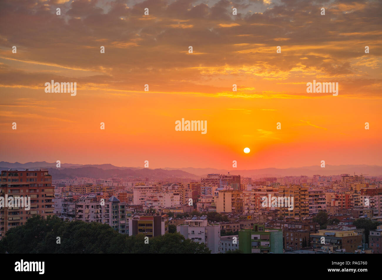 Areal cityscape view of Tirana city center at sunset. Modern ...
