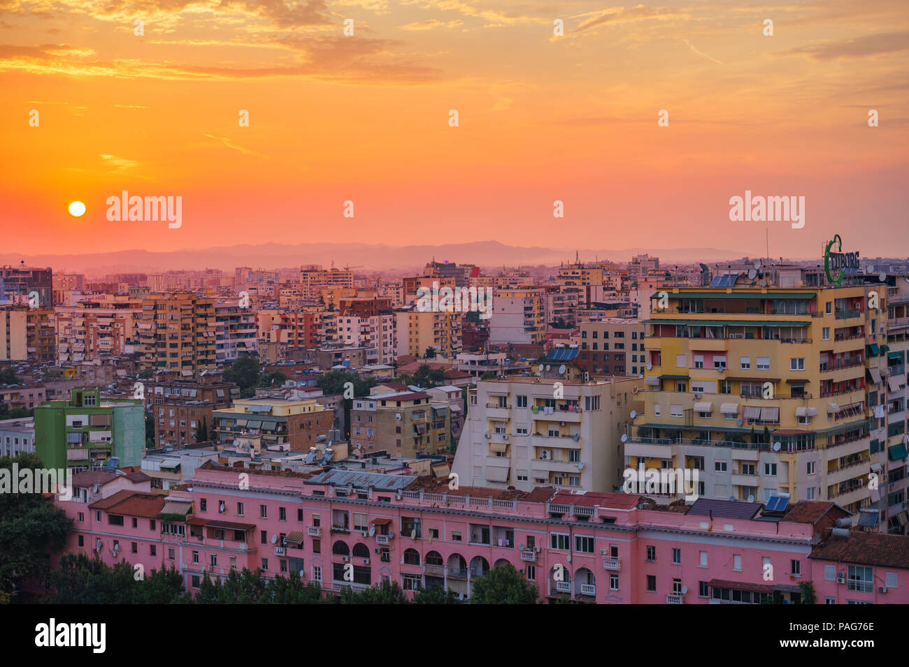 Areal cityscape view of Tirana city center at sunset. Modern ...