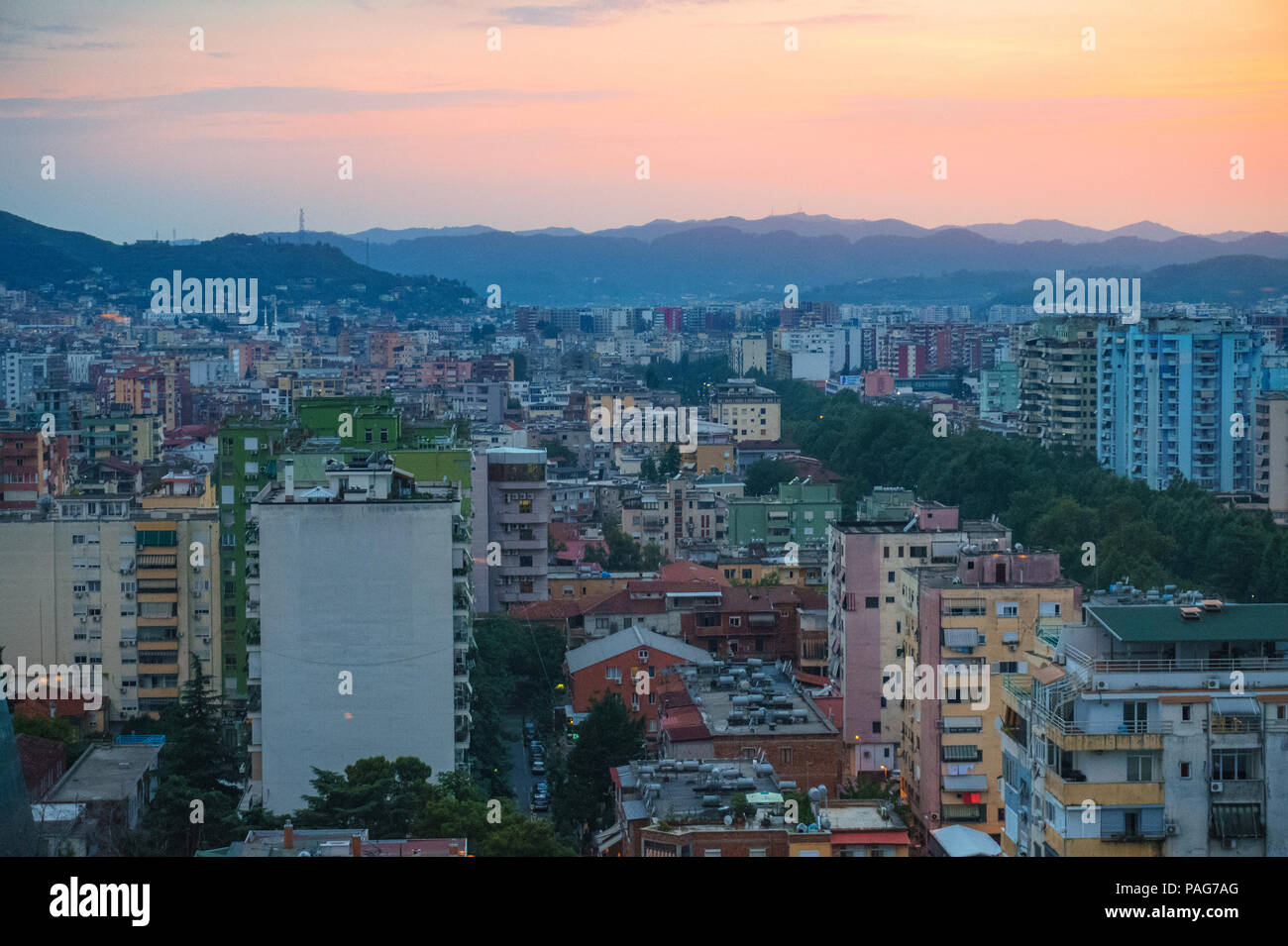 Areal cityscape view of Tirana city center at sunset. Modern ...