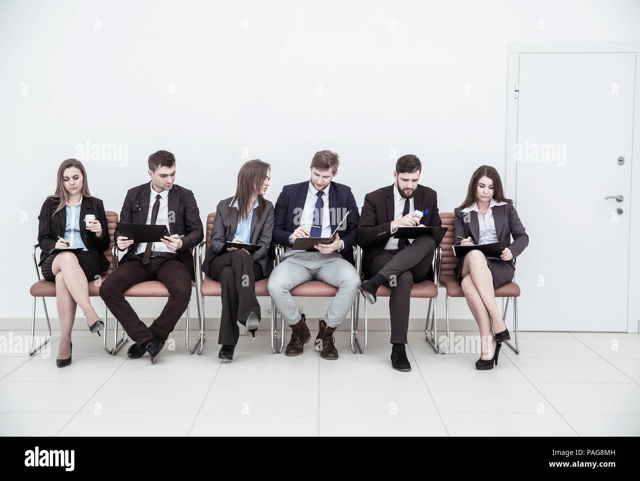 business team with documents before the working meeting, sitting in ...