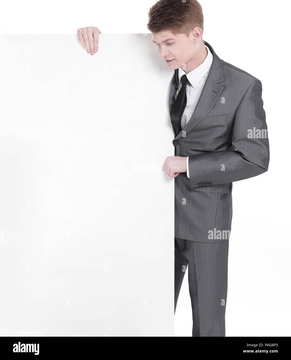 successful young businessman looking at blank banner Stock Photo - Alamy