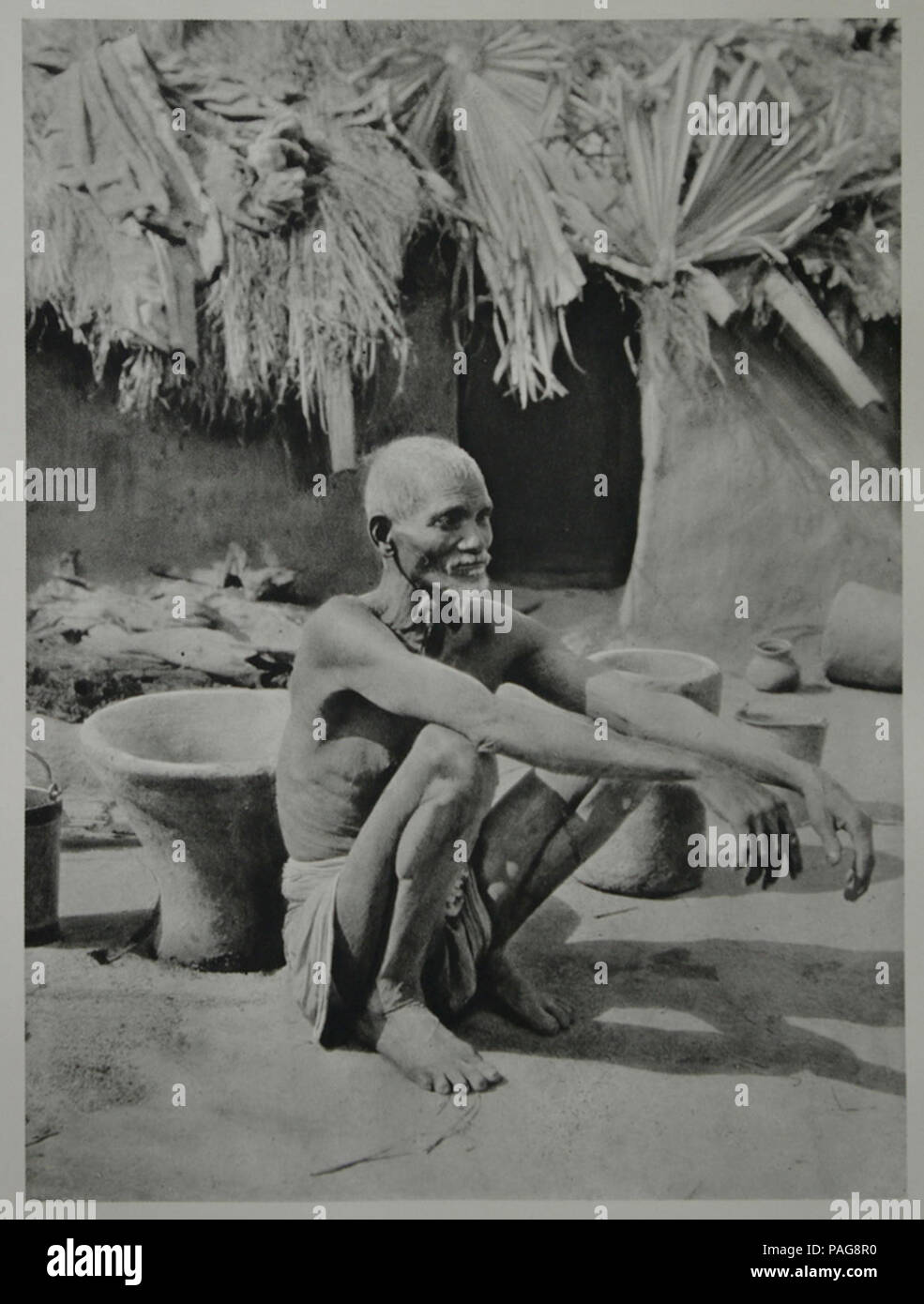 A poor man sitting in front of his hut in Patna in 1927 Stock Photo - Alamy