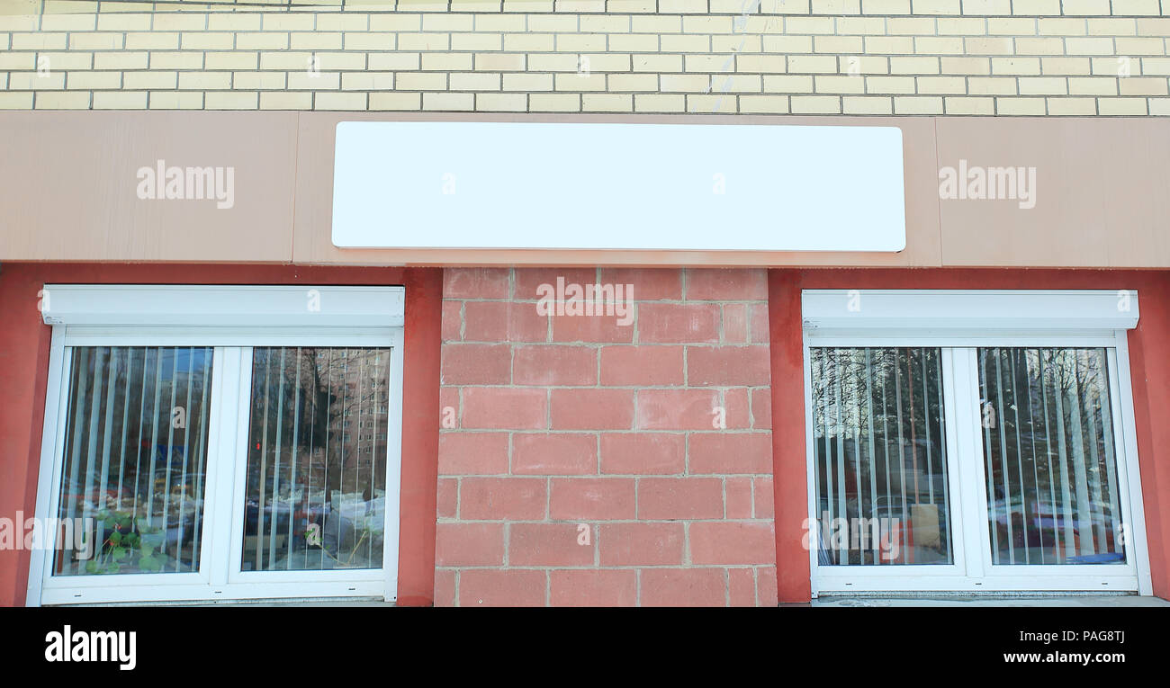 close up.empty sign above the Windows of the house Stock Photo - Alamy