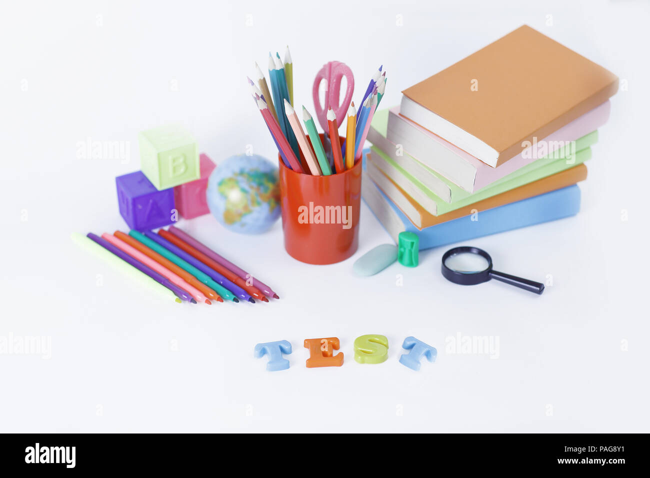 word test on the background of school supplies .photo with copy Stock ...