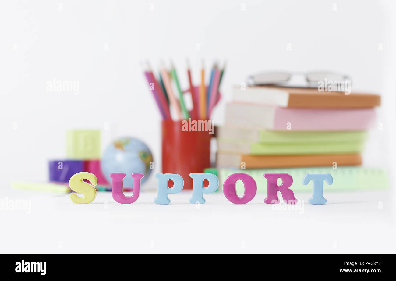 word support on blurred background of school supplies .photo with copy ...