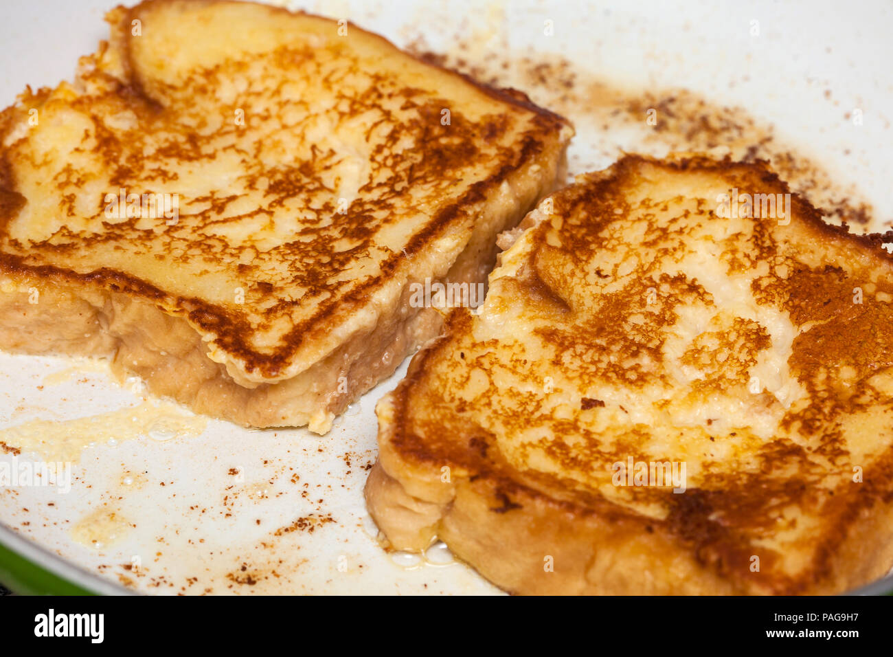 French toast preparation: Cooking french toasts on a pan Stock Photo ...