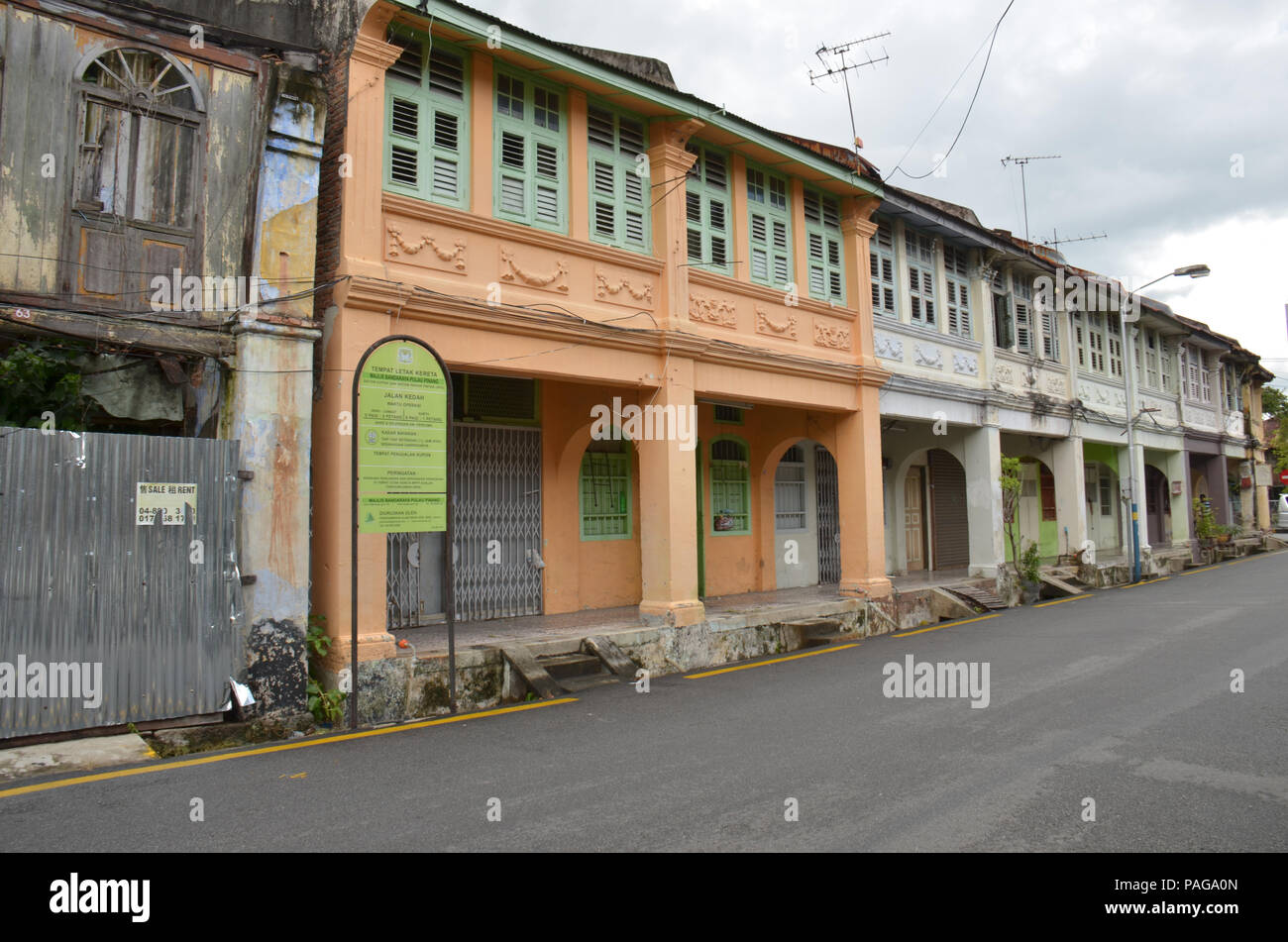 Old and poorly maintained buildings in the process of being refurbished ...