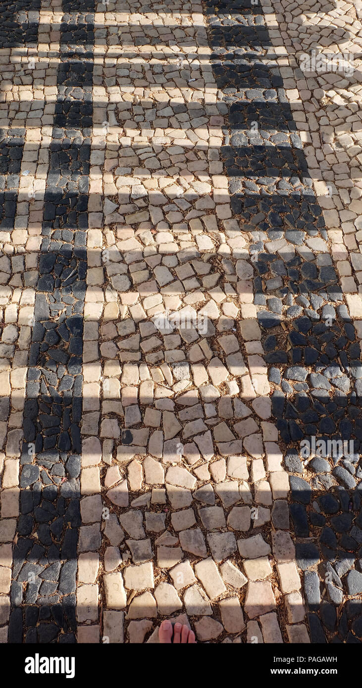 Tiled stone pavement with stripe pattern and different colors in ...