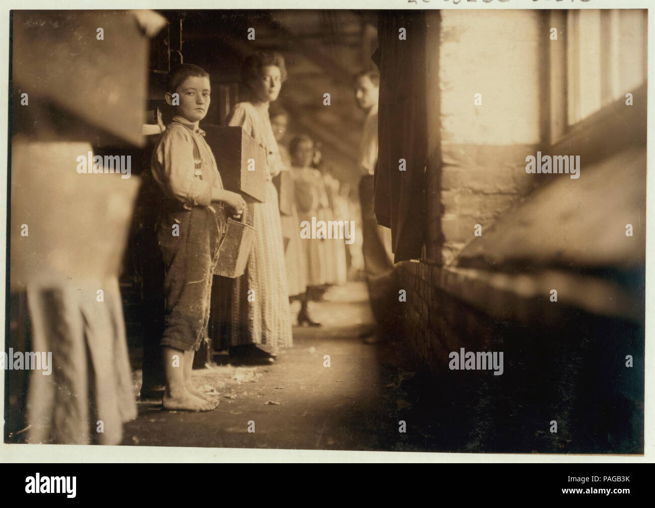 A regular worker (doffer) in Richmond Spinning Mills. Photo during work ...