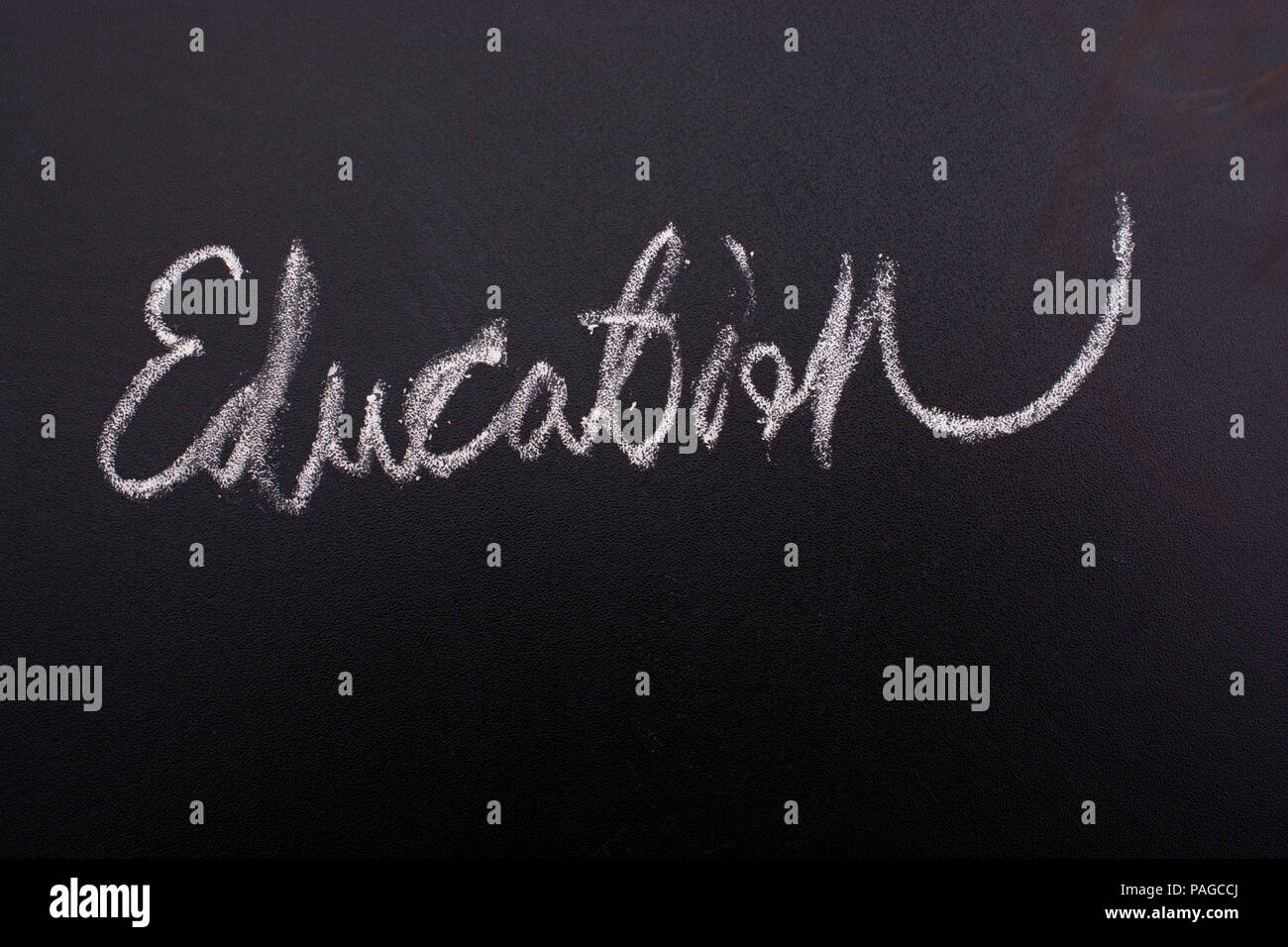 Hand written word EDUCATION with white chalk on black board Stock Photo ...