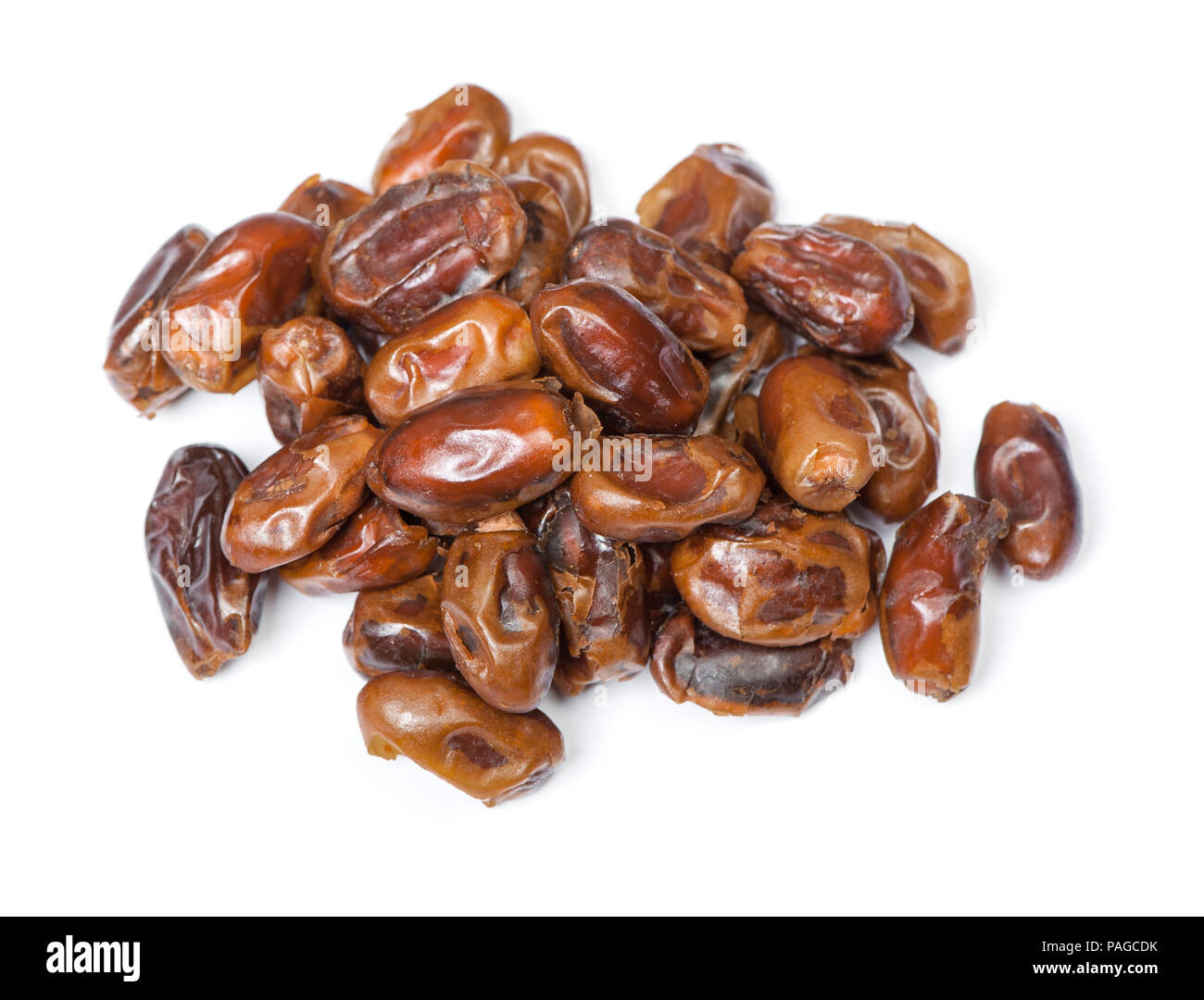 Heap of dried pitted dates isolated on white background Stock Photo - Alamy
