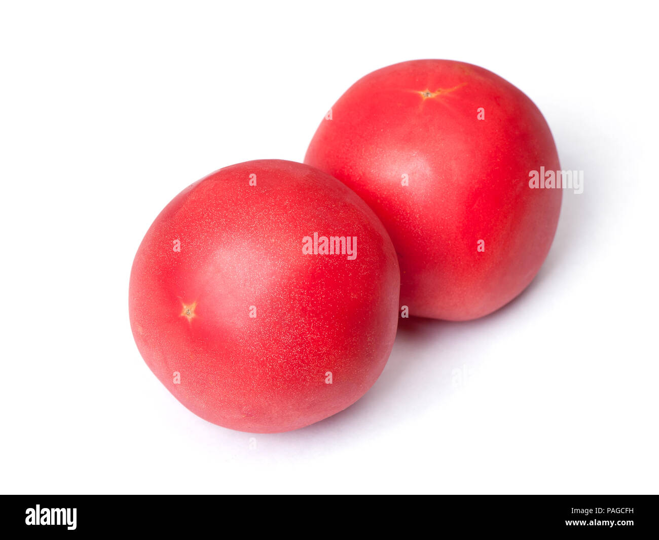 Few red tomatoes isolated on white background Stock Photo - Alamy