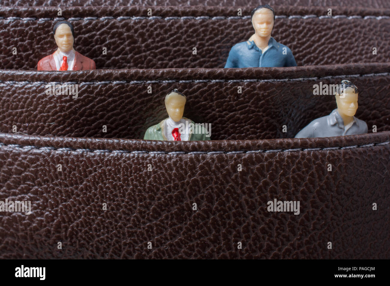 Tiny figurine of group of men miniature model in pockets Stock Photo ...