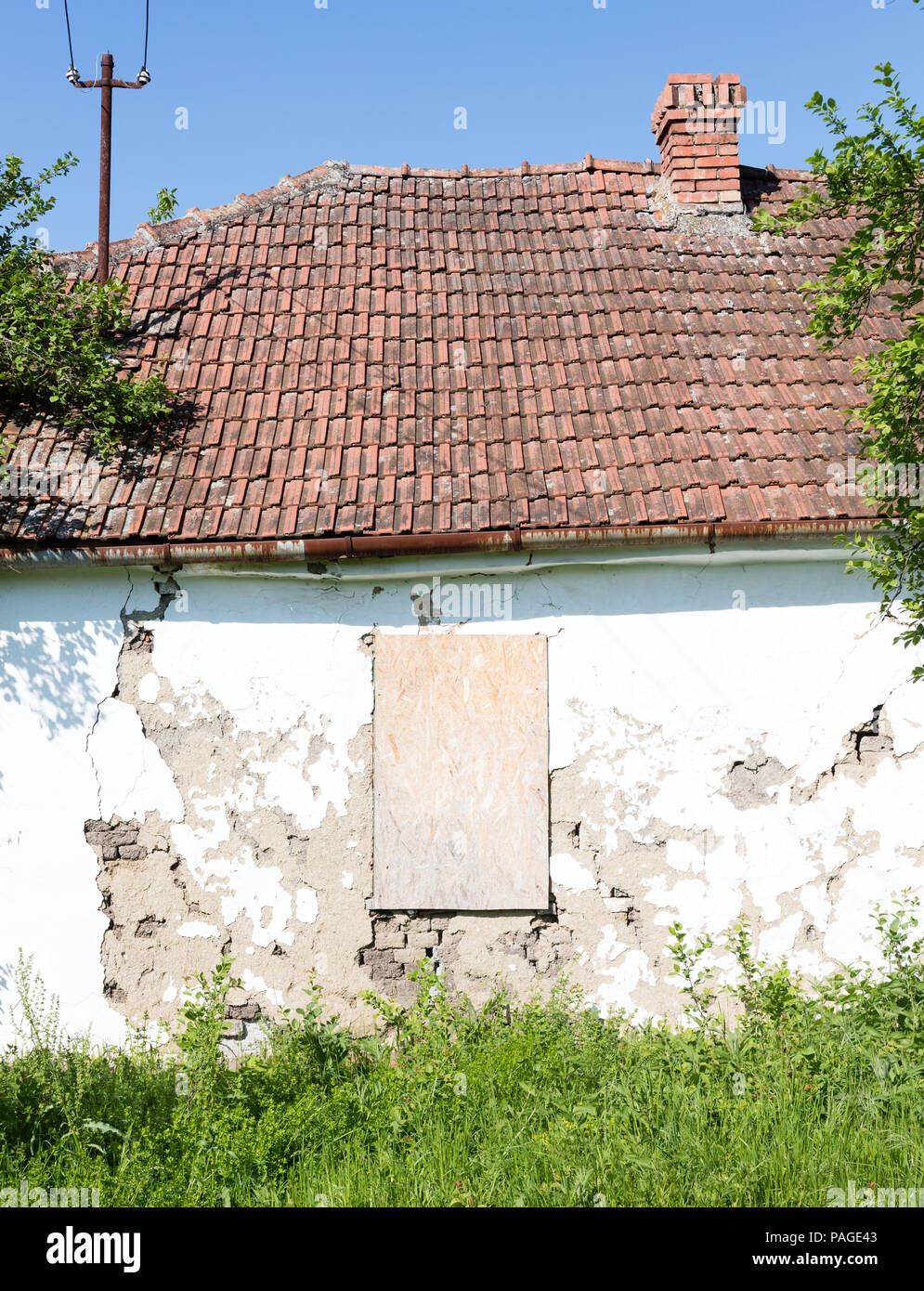 Broken window of an abandoned house in Romania Stock Photo - Alamy