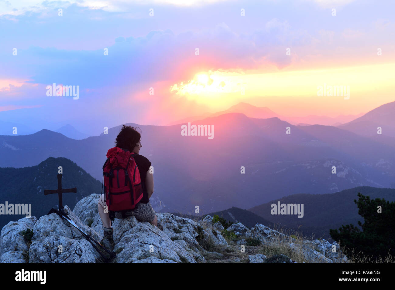 hiker contemplating the sunset Stock Photo - Alamy