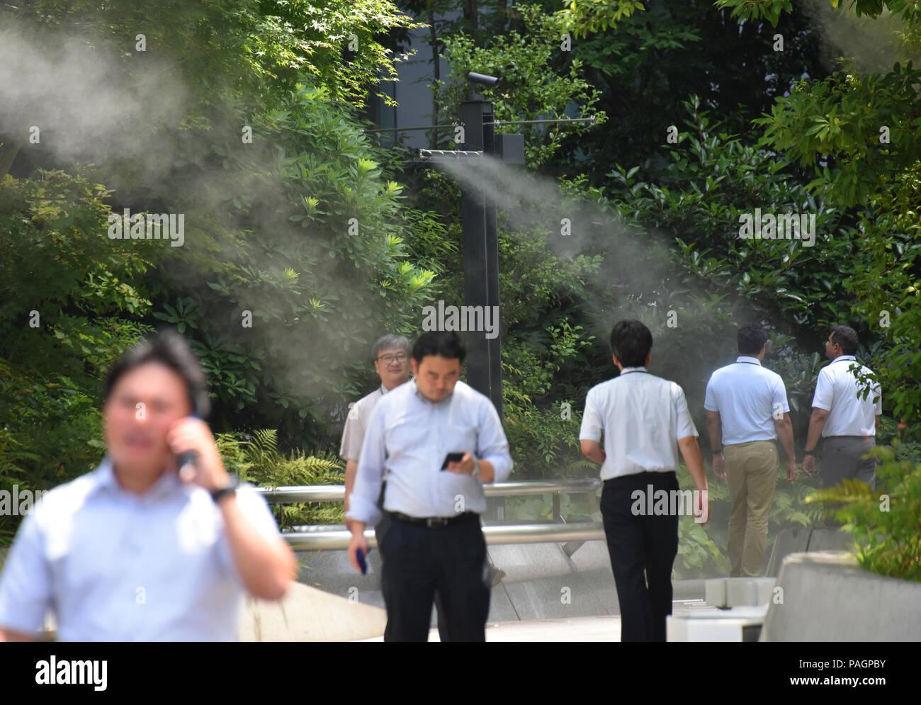 Tokyo, Japan. 23rd July, 2018. Cool mist spray doesnt help much in a ...