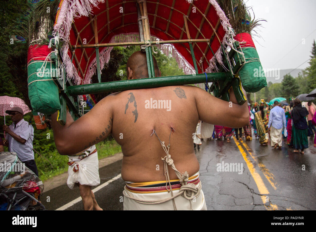 Val-Morin, Canada, July 22, 2018. Hindu devotee carrying a kaavadi on ...
