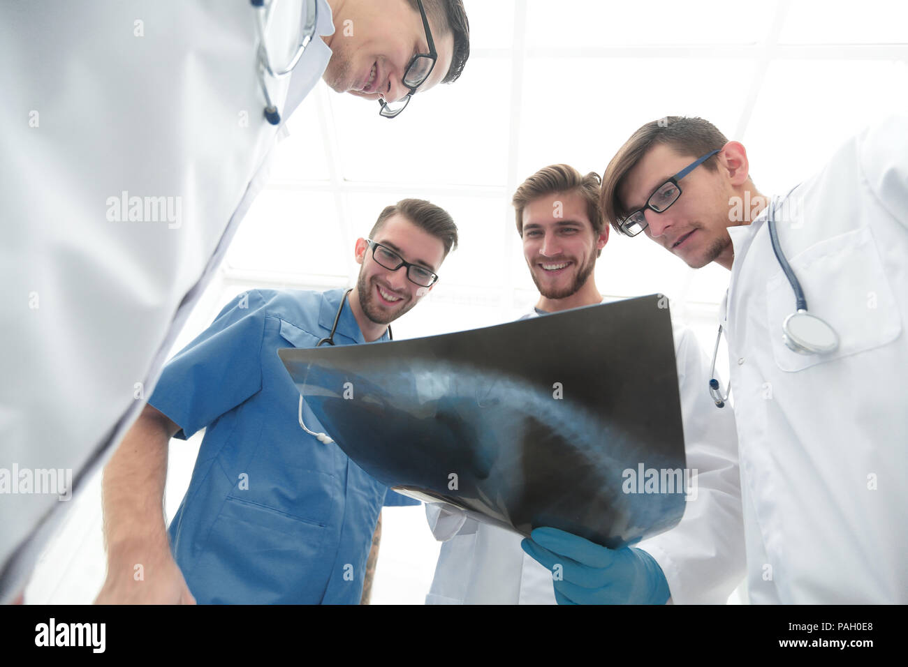 bottom view.team of doctors discussing an x-ray Stock Photo - Alamy