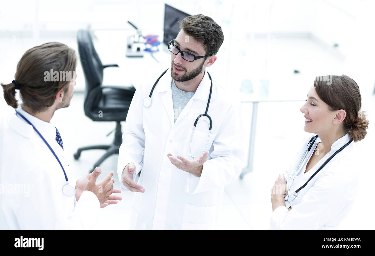 Group of doctors talking Stock Photo - Alamy