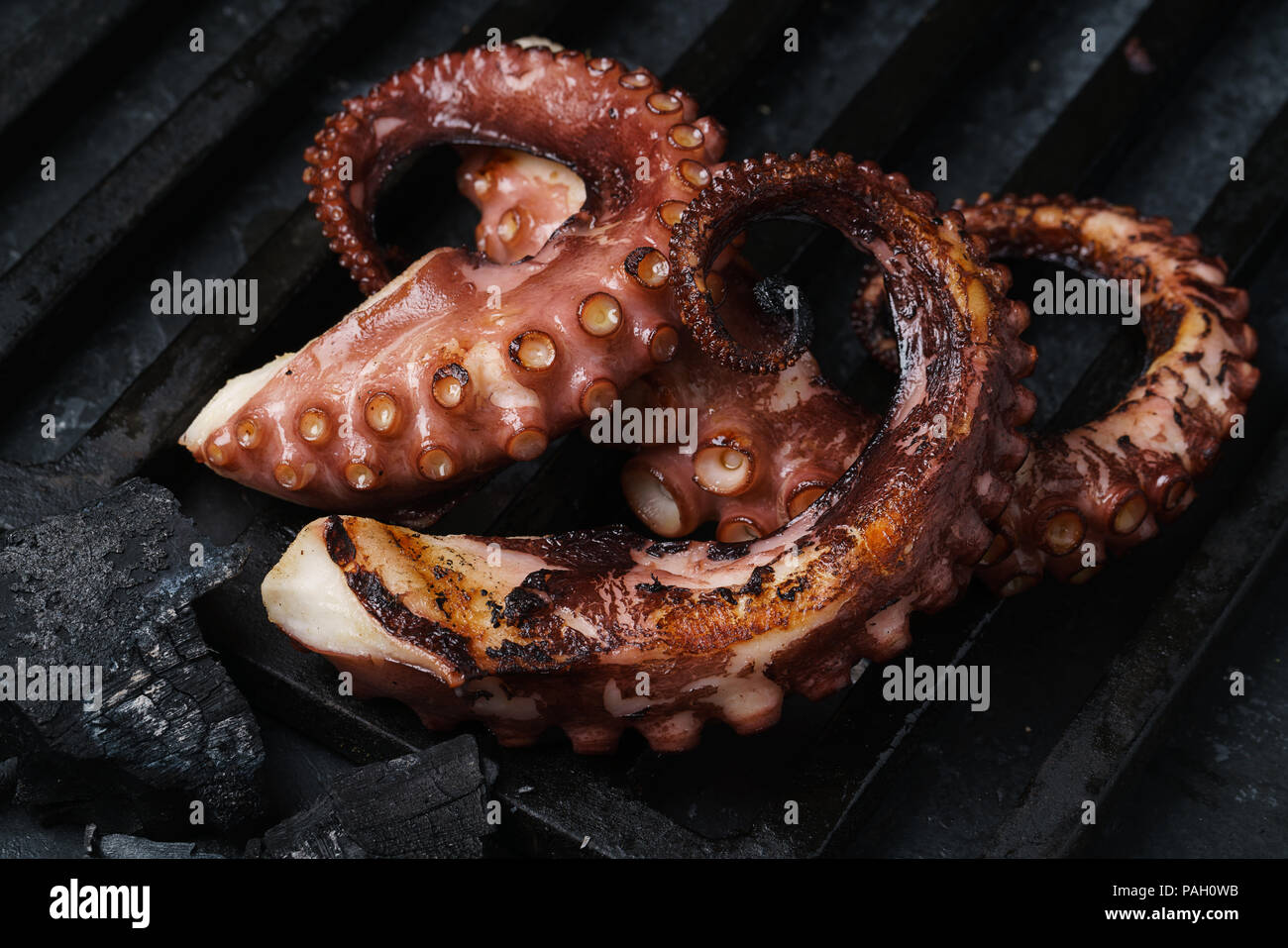 Octopus cooked on grill barbecue hi-res stock photography and images ...
