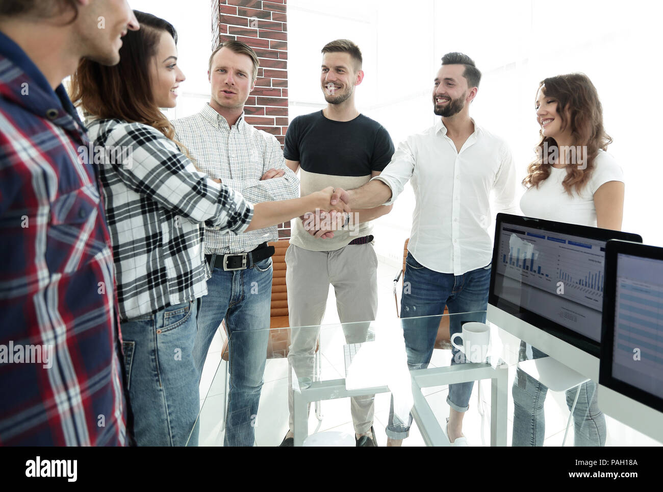 handshake young designer and the client Stock Photo - Alamy