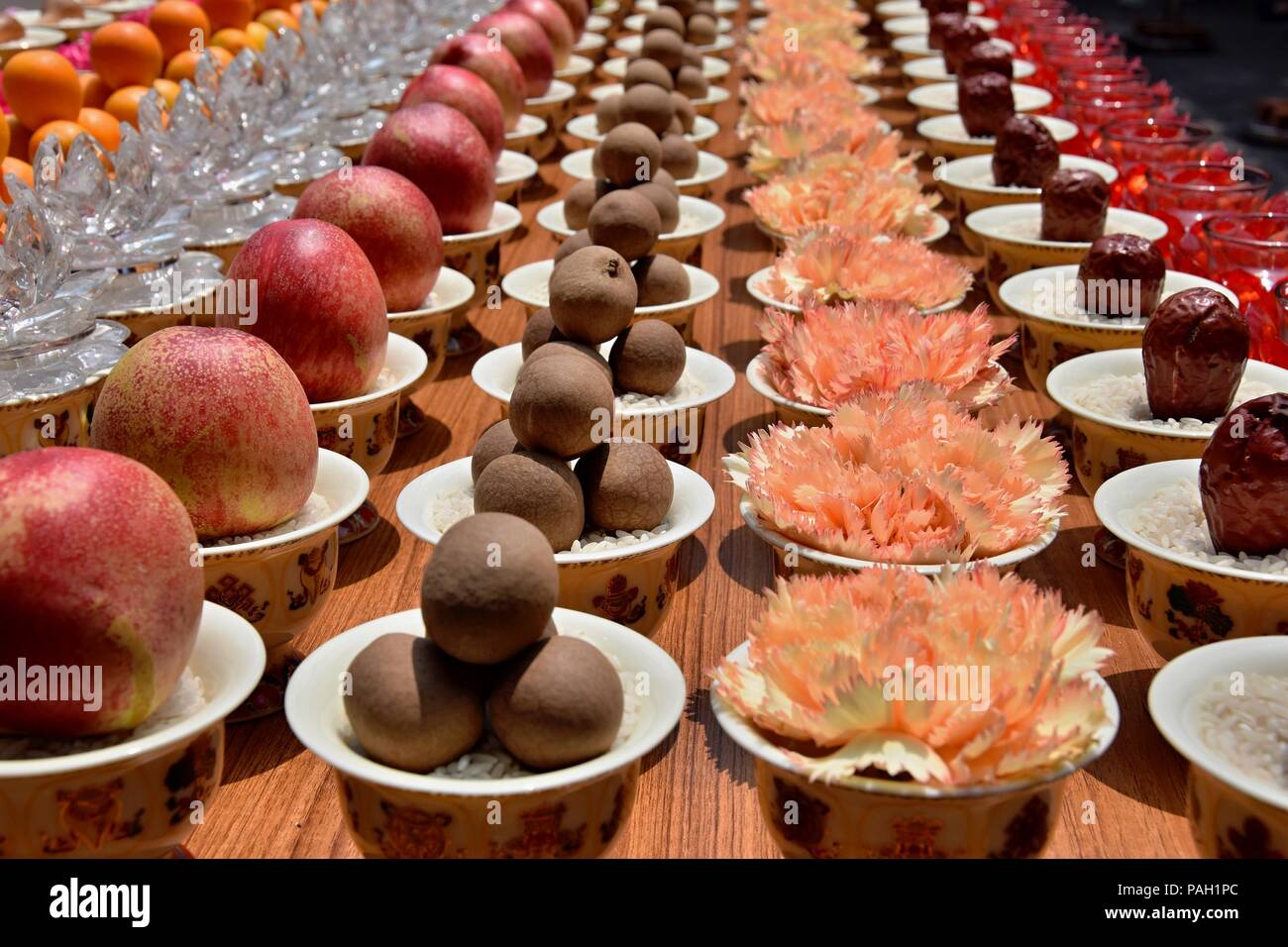 Sacrificial altar with offerings such as fruits and flowers in the ...