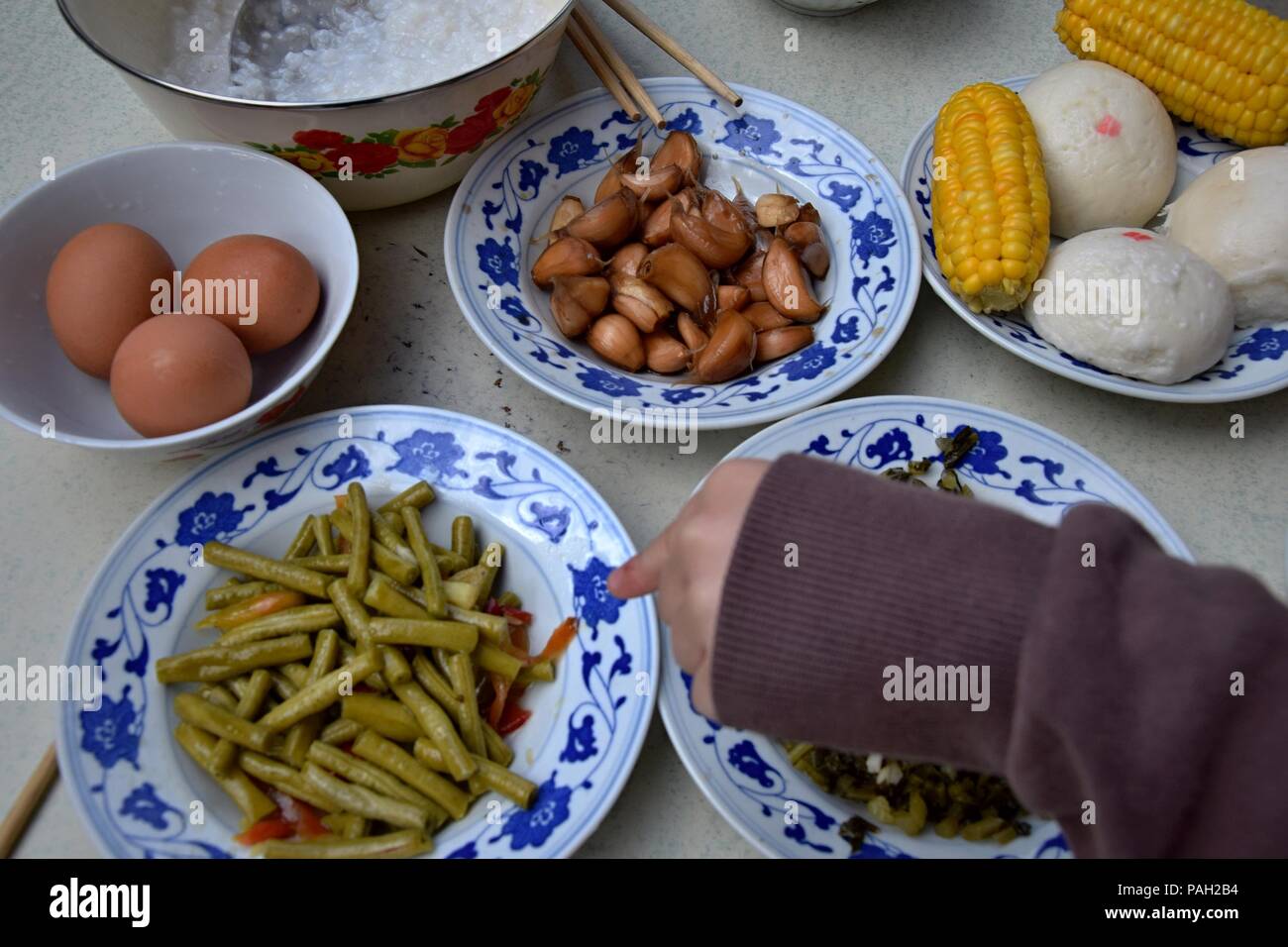 A small kid pointing at the plates with delicious home-made food Stock ...