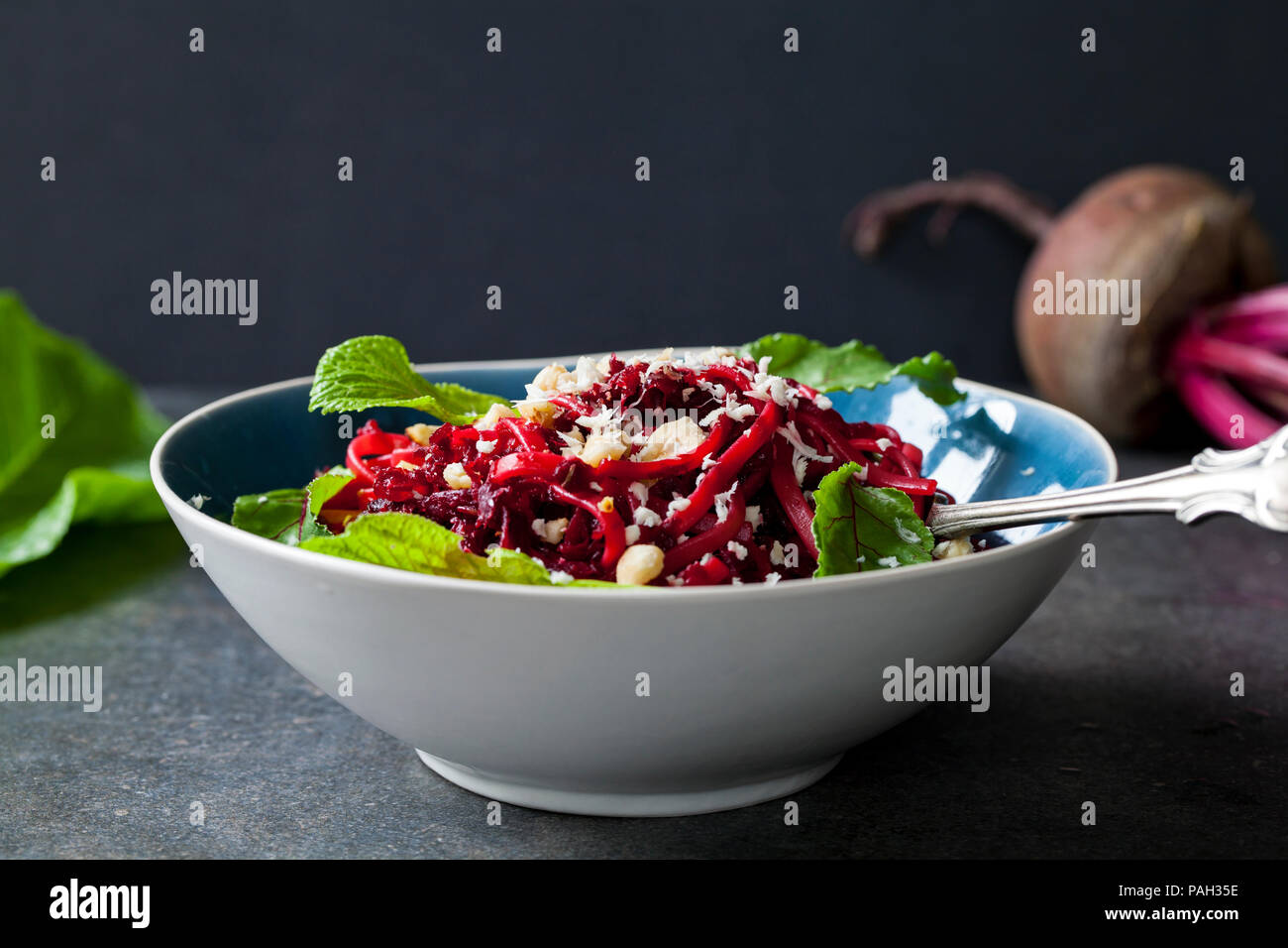 Beetroot spaghetti with hazelnuts and horseradish Stock Photo - Alamy