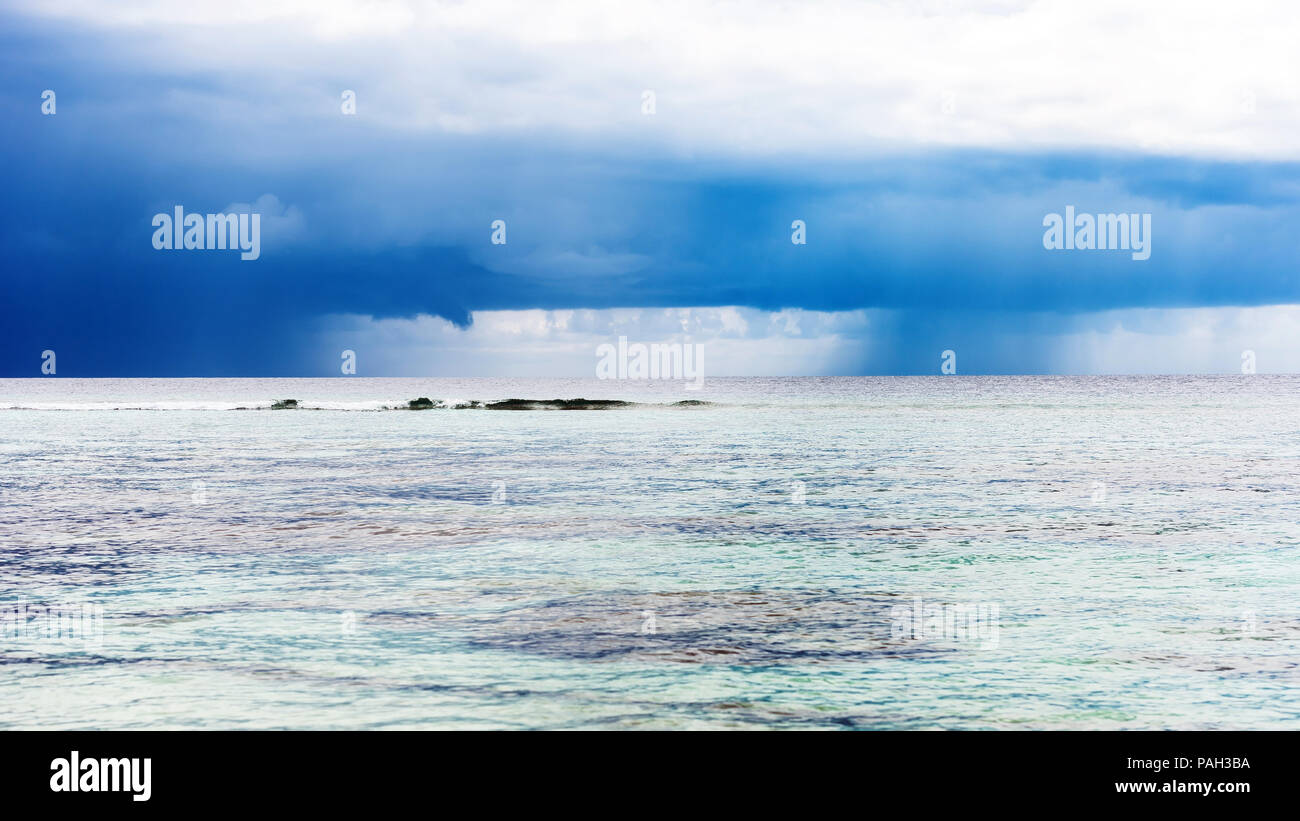 The rain cloud hovered over the sea, Male, Maldives. Copy space for ...