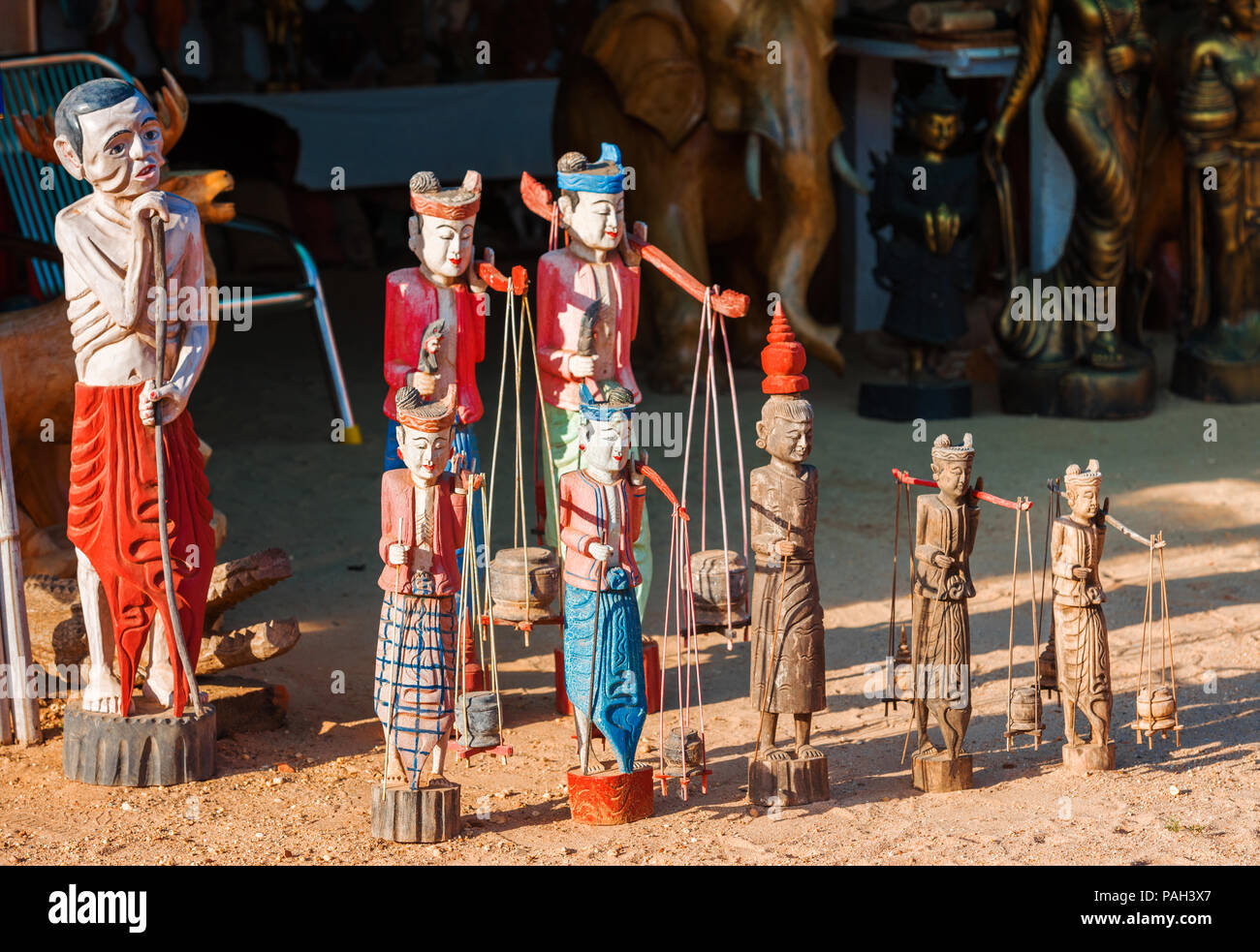 Sale of wooden handmade statues in Bagan, Myanmar Stock Photo - Alamy