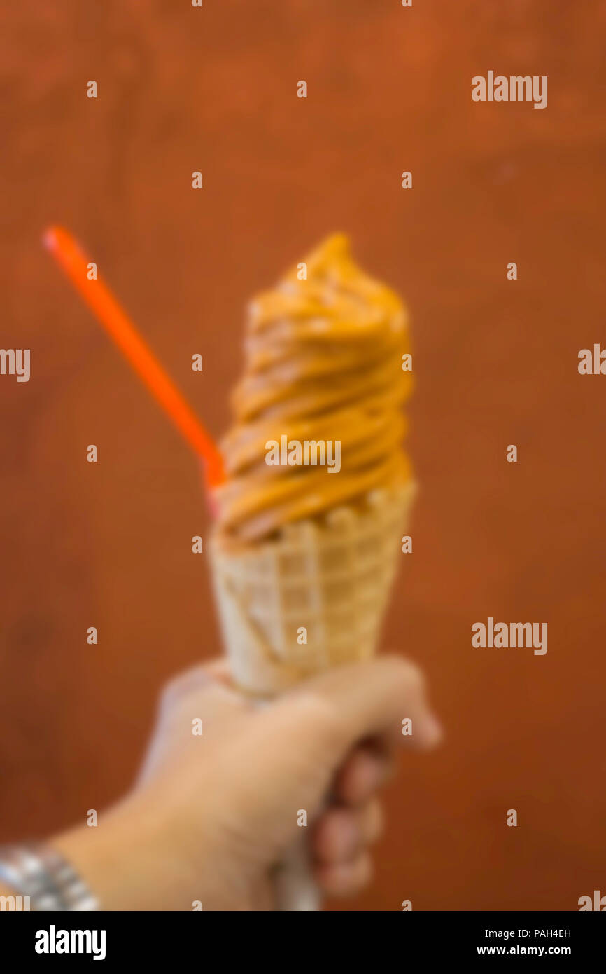 Thai tea soft serve ice cream cone, stock photo Stock Photo - Alamy