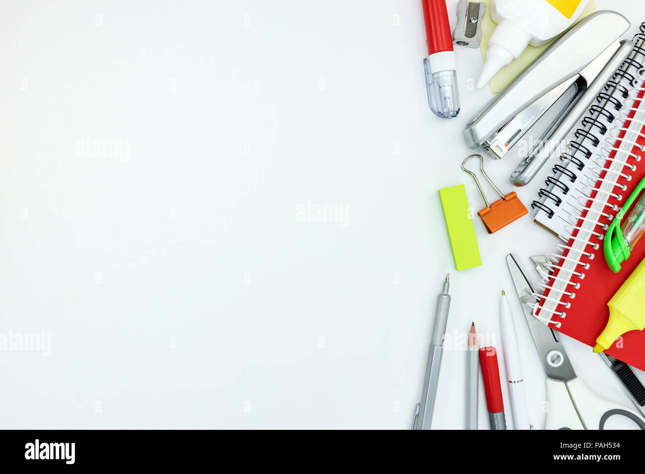 various office supplies and tools on white desk background with copy ...