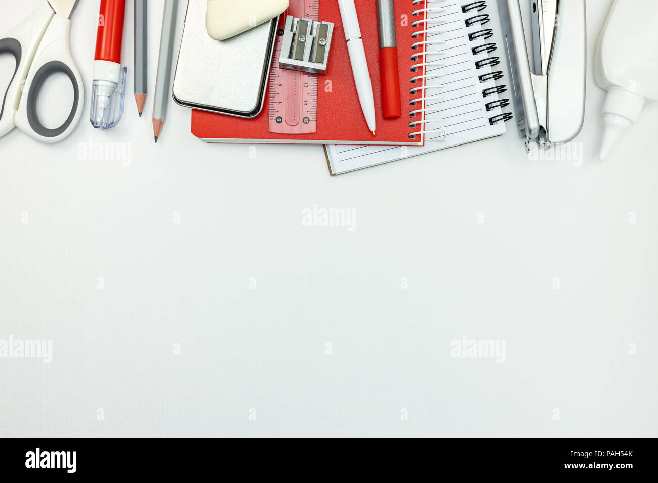different tools and accessories for office work on white background ...